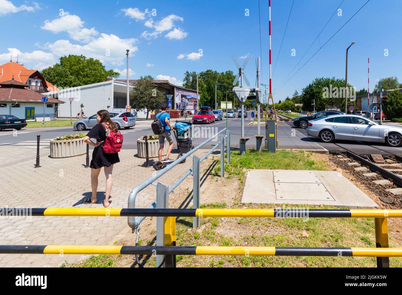 Level crossing with cars and tourists in Balatonlelle, near Lake ...