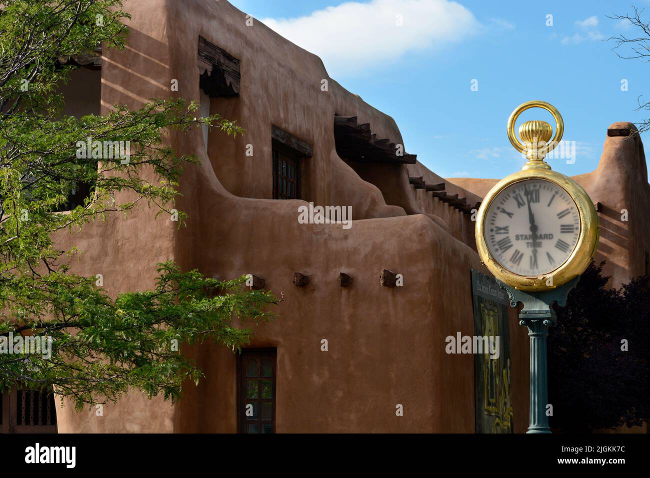A vintage clock tower, or post clock, in front of the New Mexico Museum ...