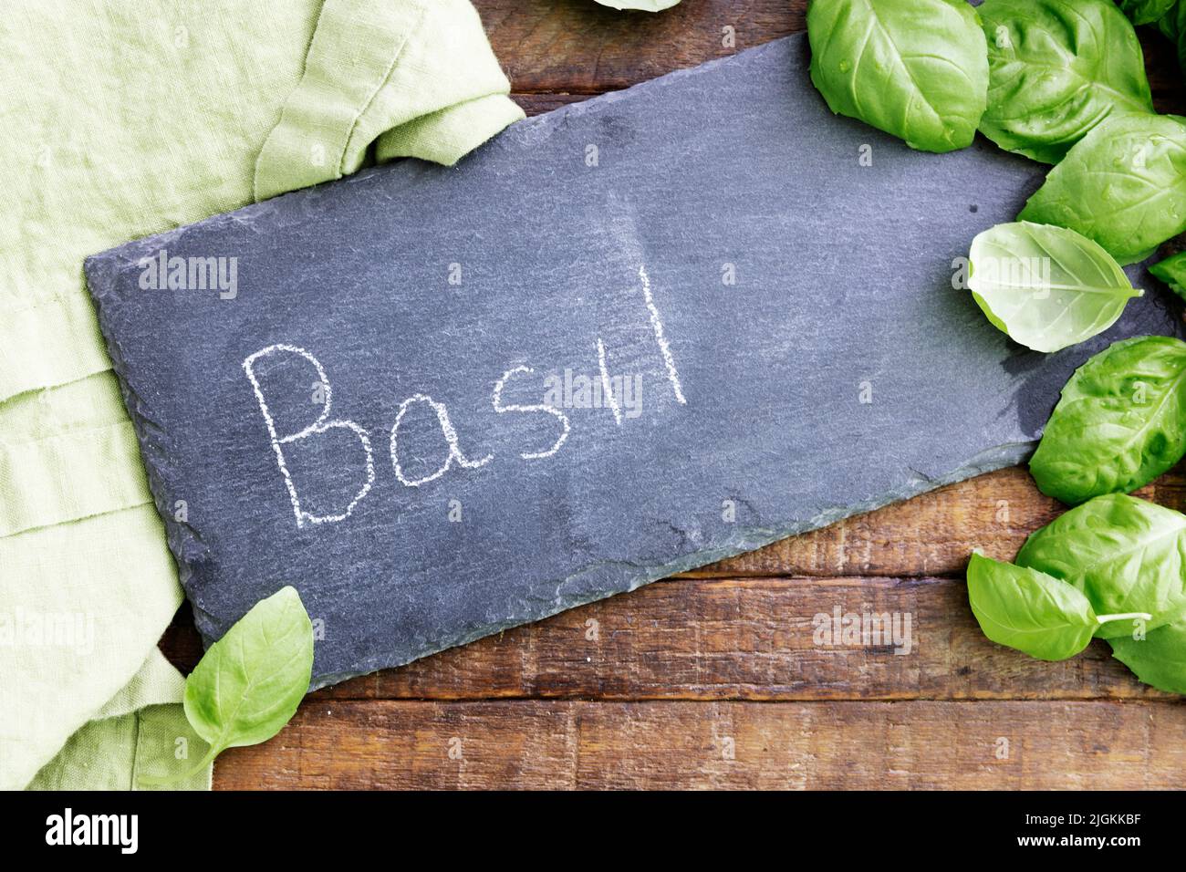 Fresh basil and a chalkboard sign with Basil written on it Stock Photo ...