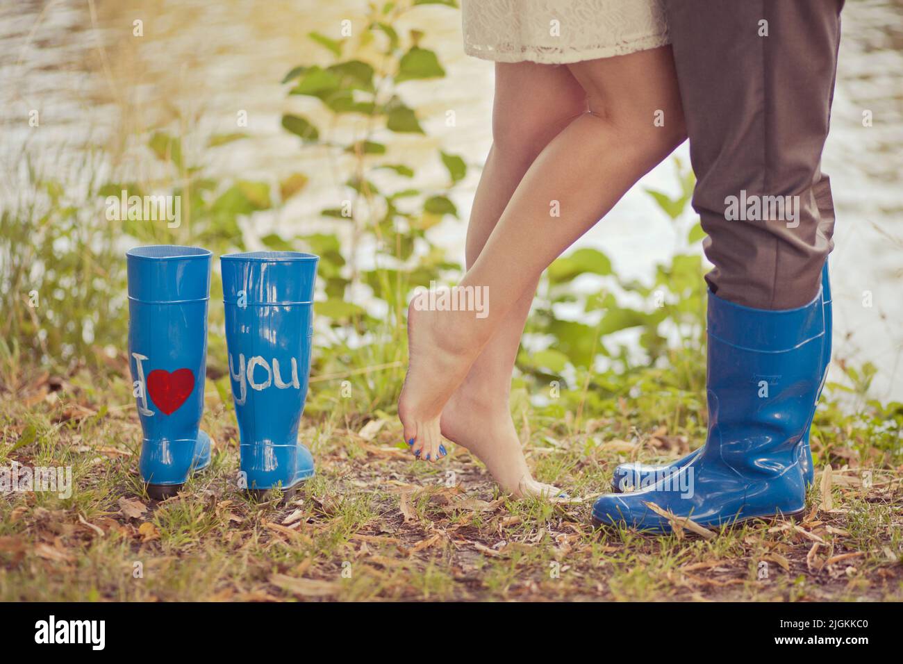 Blue rubber boots with the inscription I love you stand in the forest ...