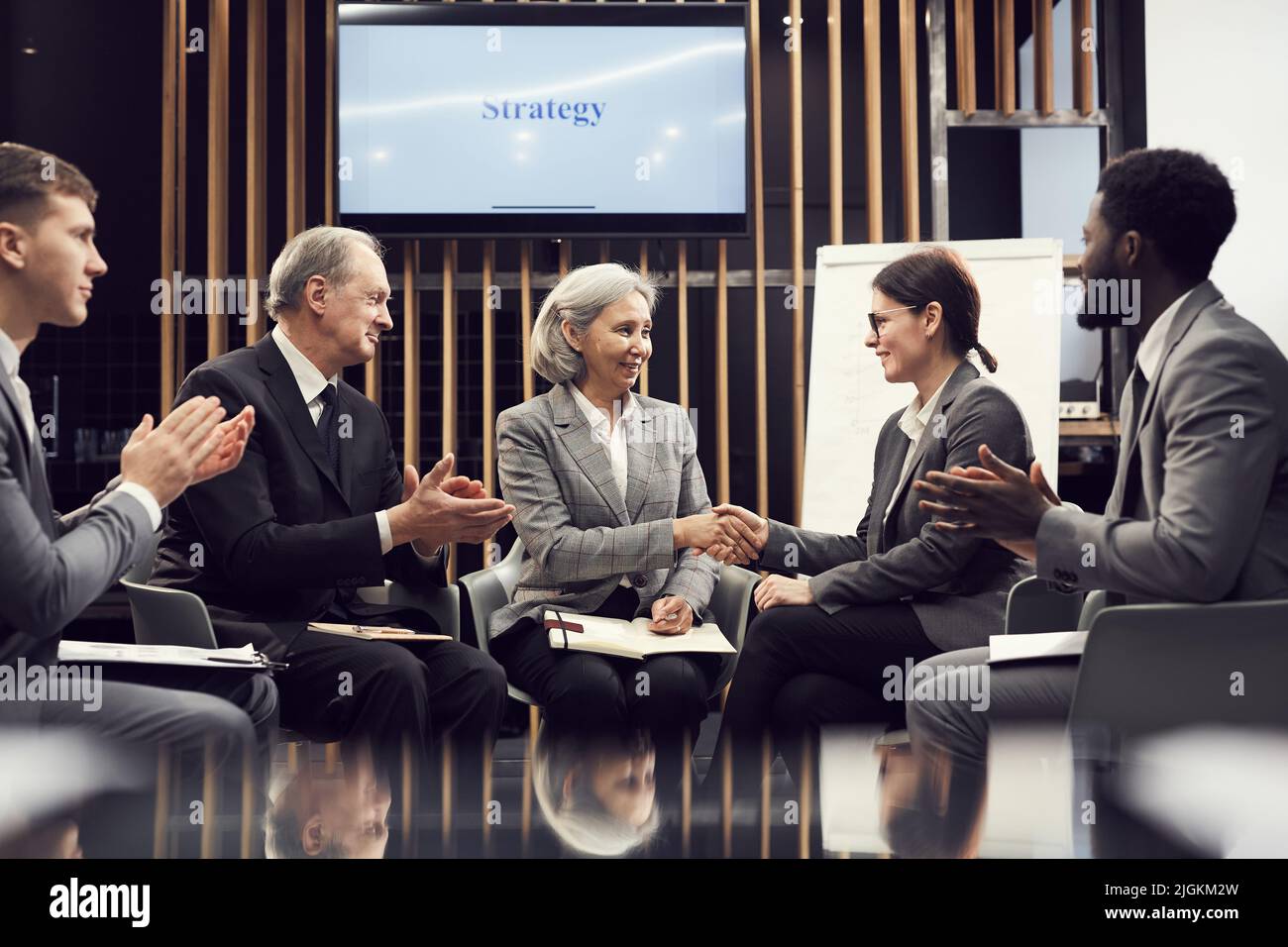 Group of multi-ethnic like-minded business people sitting in meeting ...