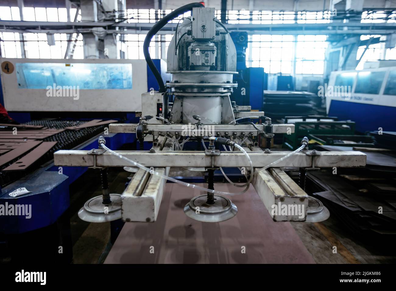 Mechanical vacuum lifter. Loading unit of cutting machine Stock Photo ...