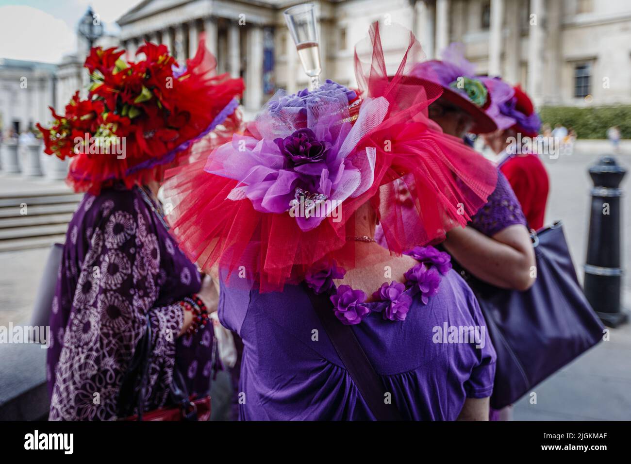 A group of red hatted women in London. The Red Hat Society is a ...