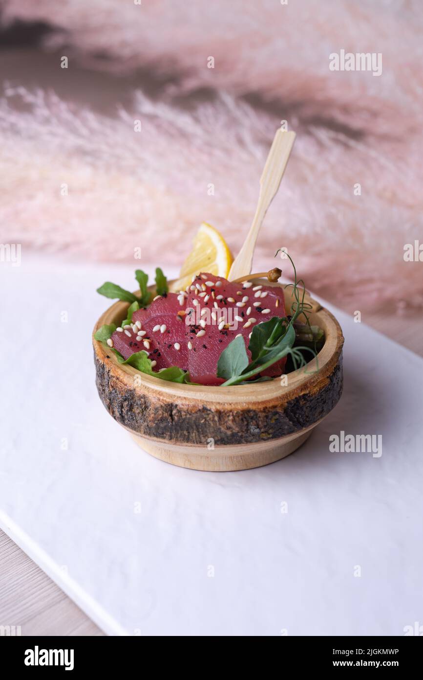 sliced meat in a small wooden plate at a buffet Stock Photo - Alamy
