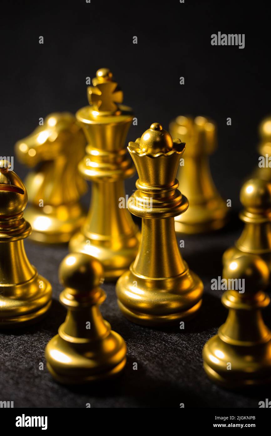 Board game chess. Gold colored figures close-up Stock Photo - Alamy