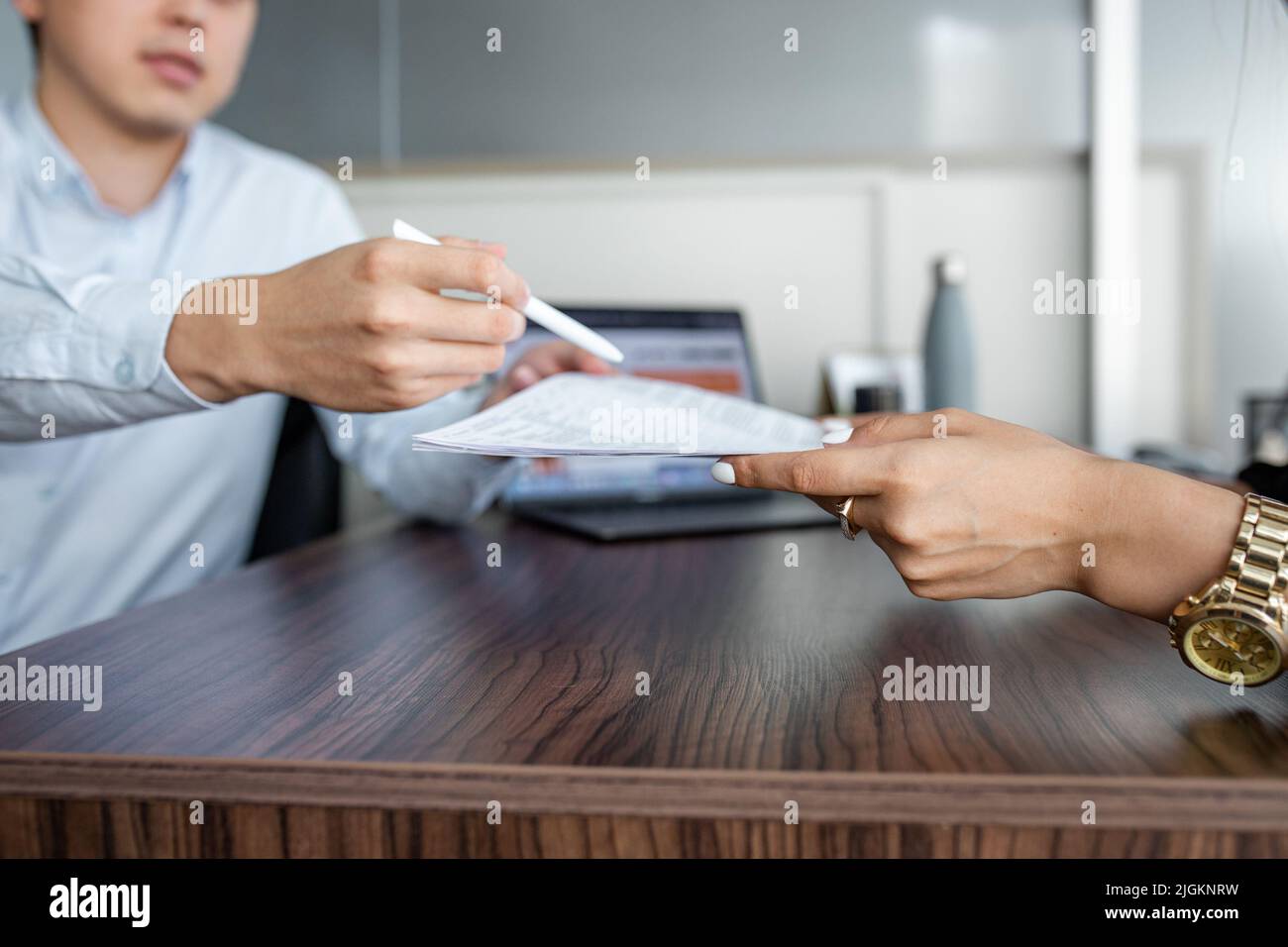 Business man giving pen sign hi-res stock photography and images - Alamy