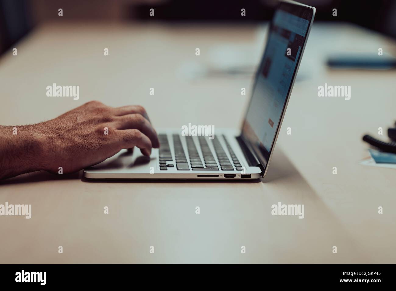 business man hand working on blank screen laptop computer on wooden ...