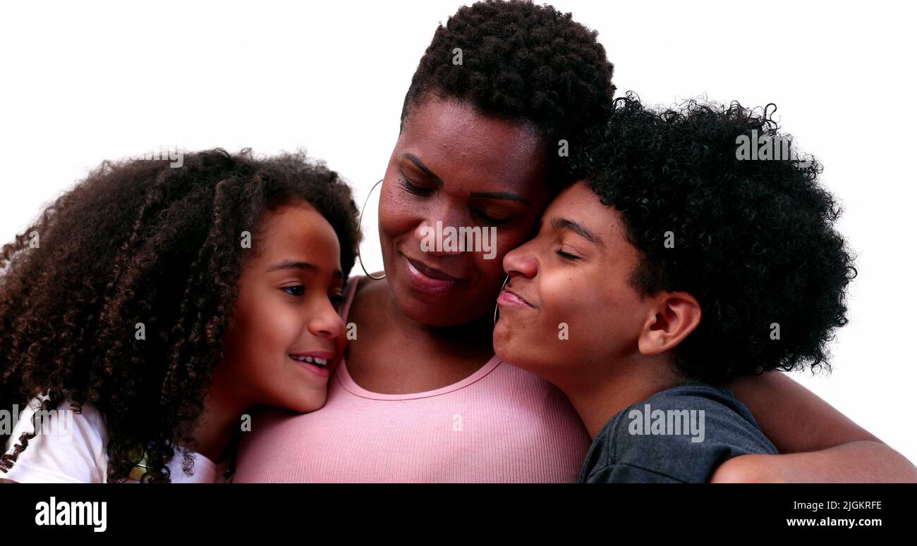 African mother embracing son and daughter. Mixed race mom hugging ...