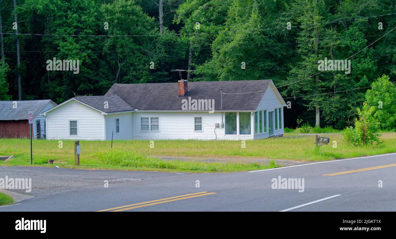 Old White Siding House on Rural Road with Shed Out Back Stock Photo - Alamy