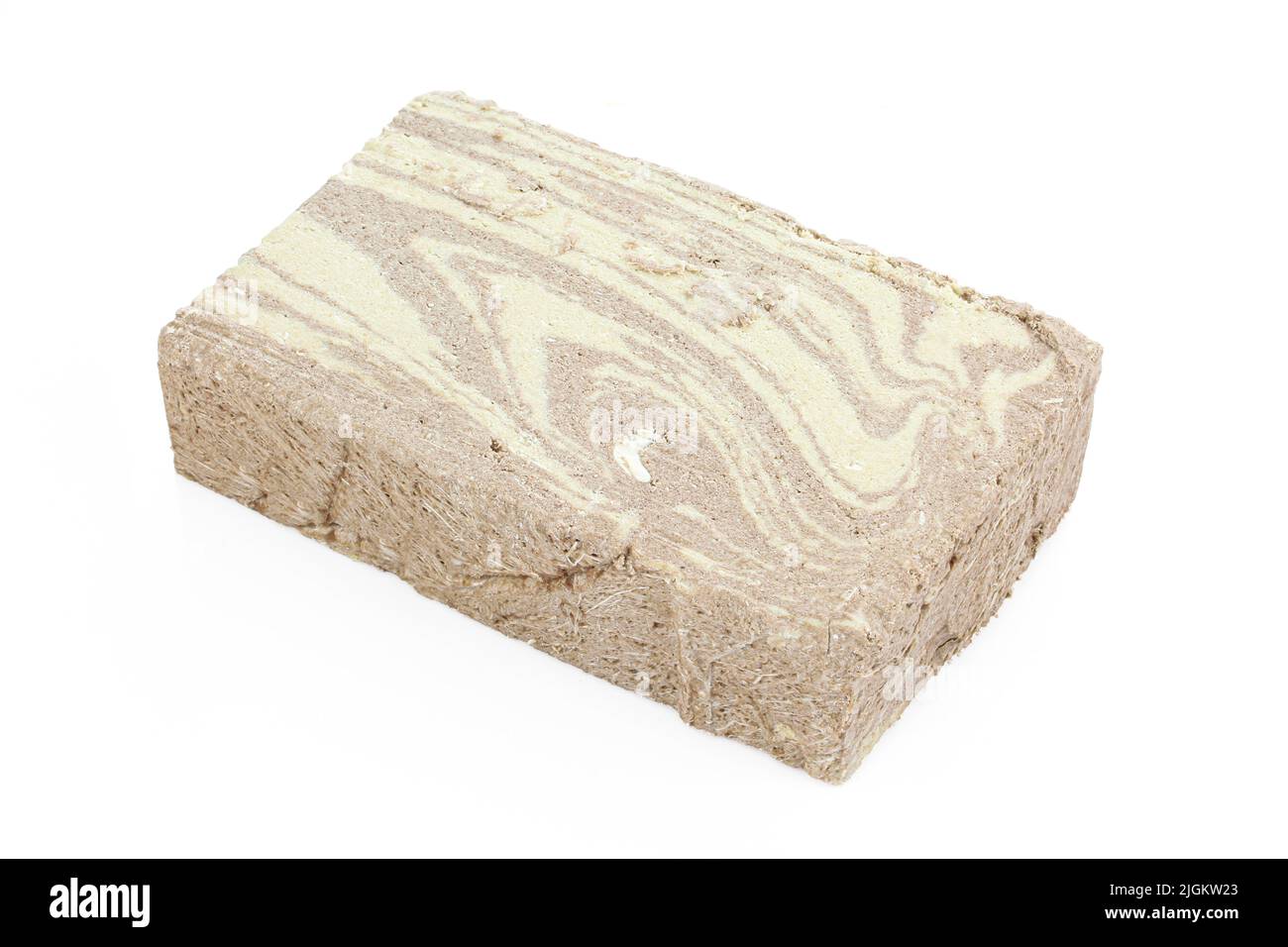 Big chunk of dark tahini halva isolated on white background. Turkish ...
