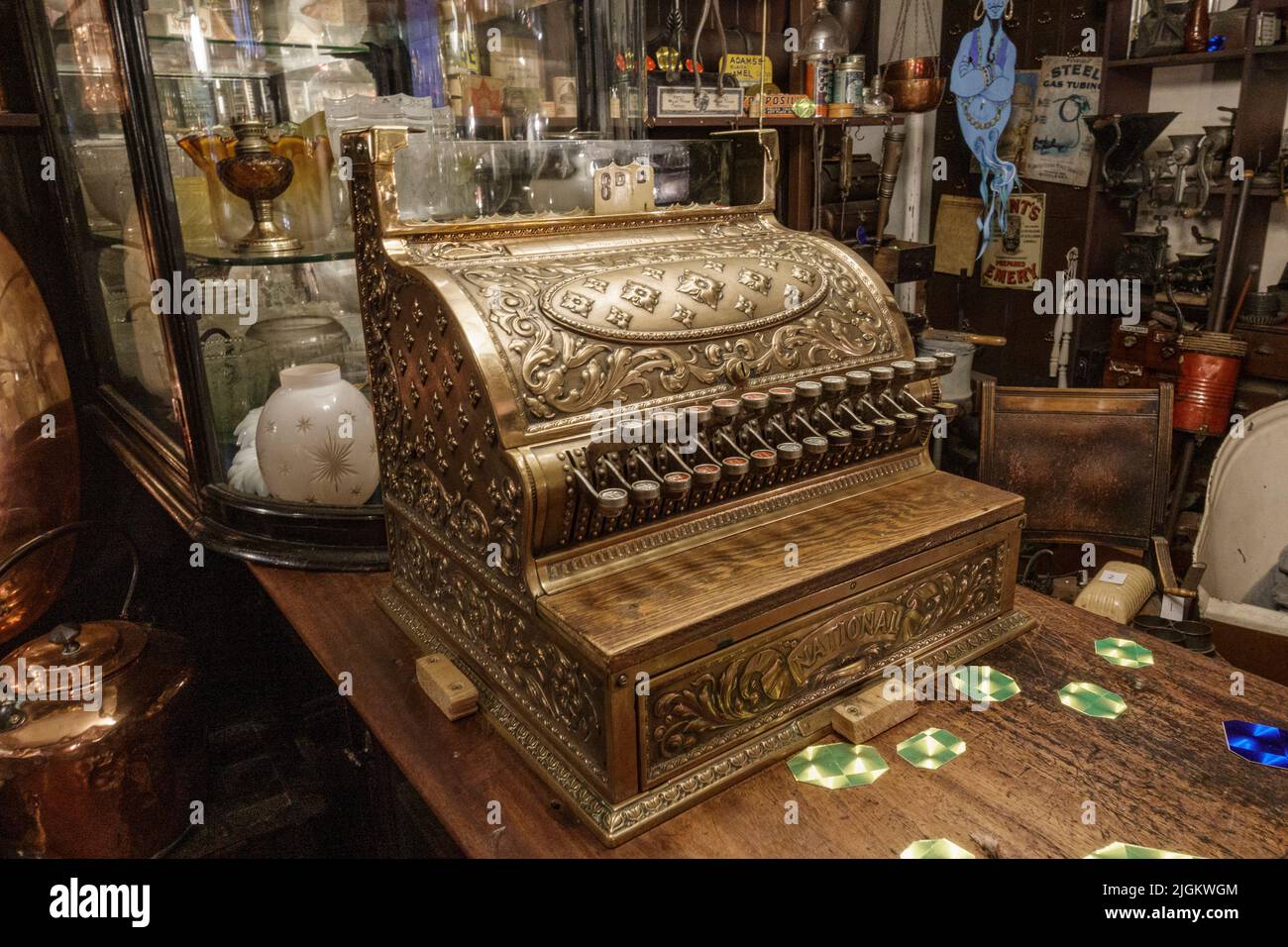 A golden coloured brass vintage National cash register on display in a ...