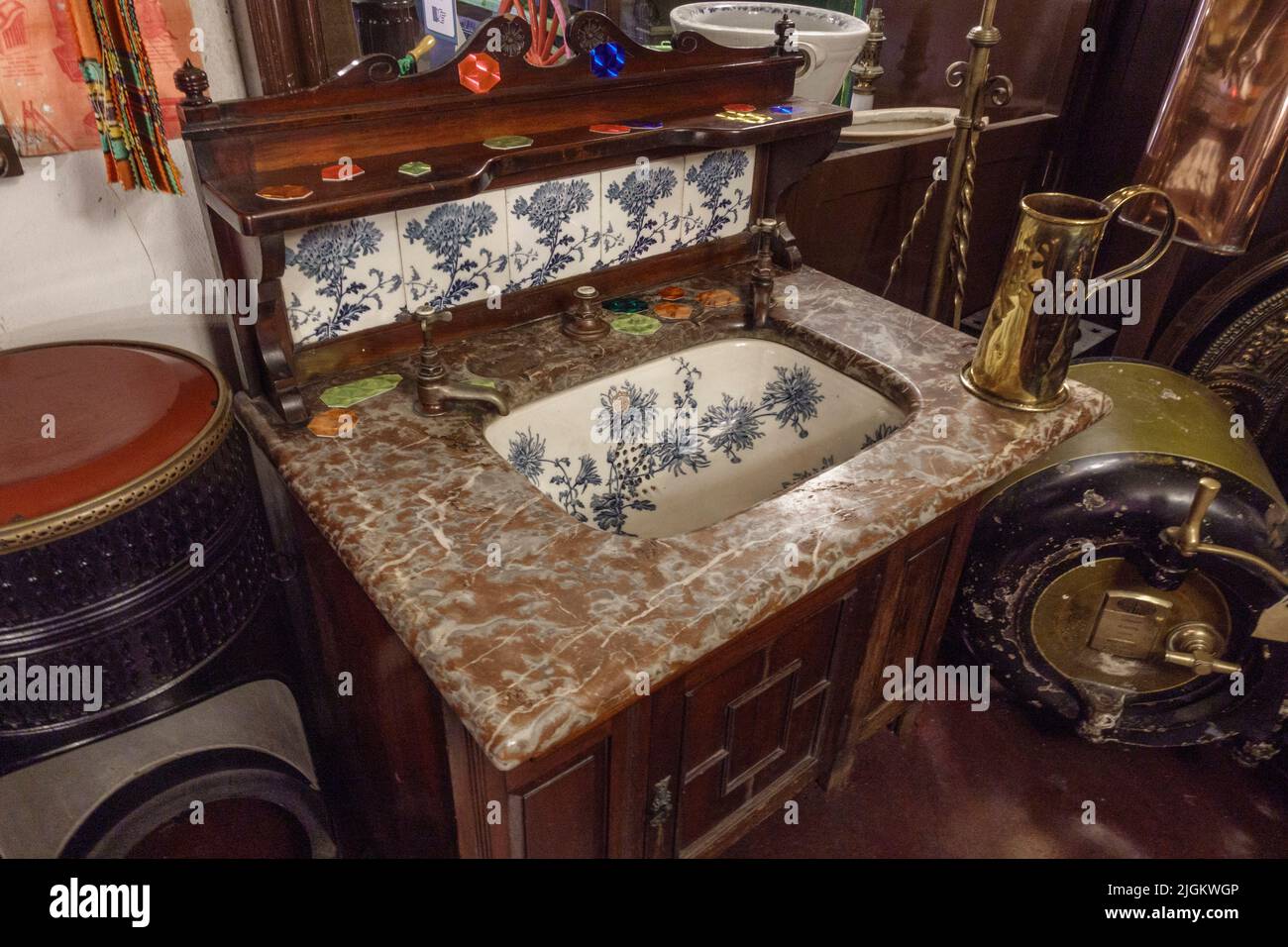 An ornate porcelein bathroom sink unit on display in a museum in the UK ...