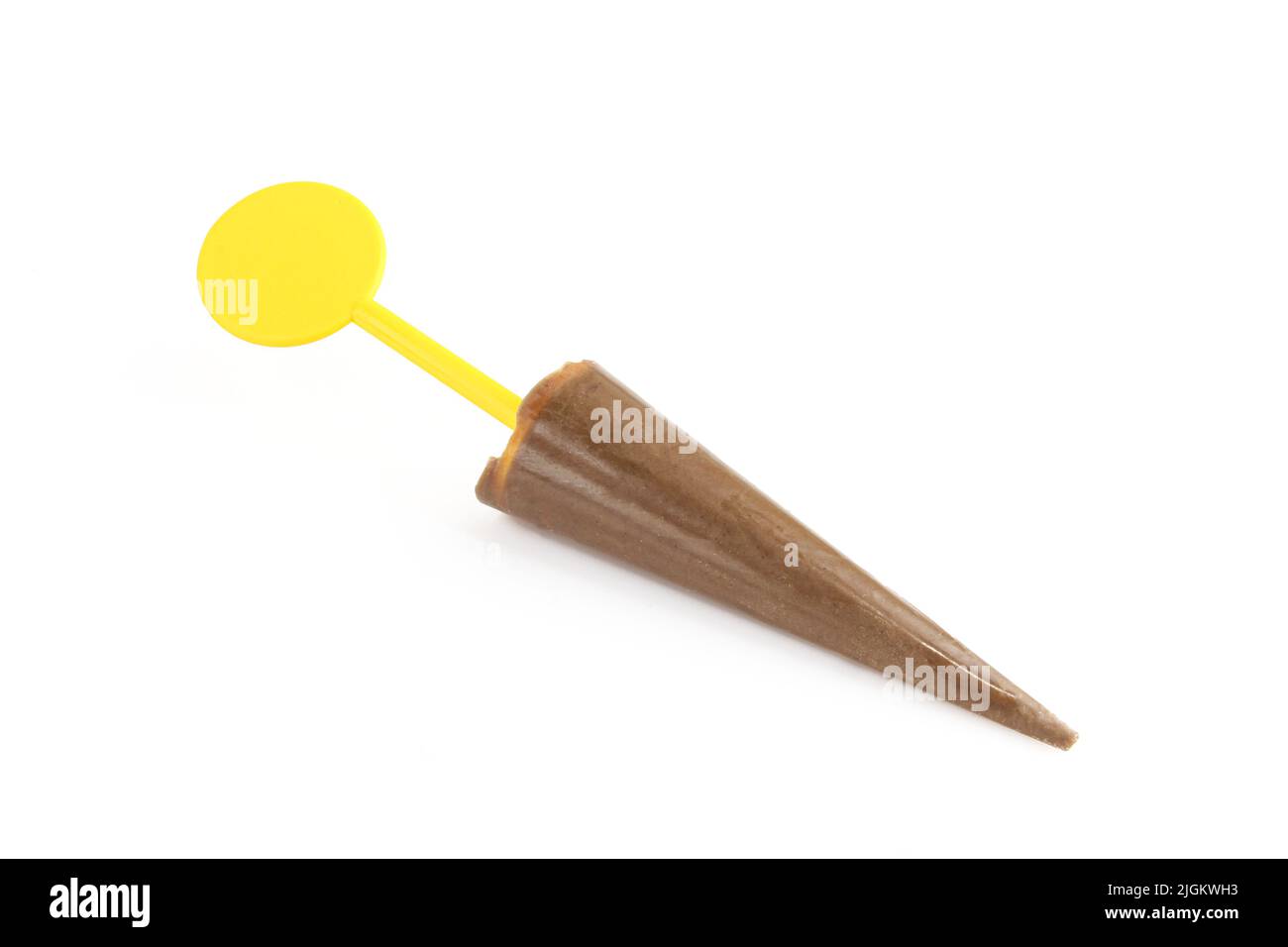 Chocolate candy snack for kids on plastic yellow stick isolated on ...