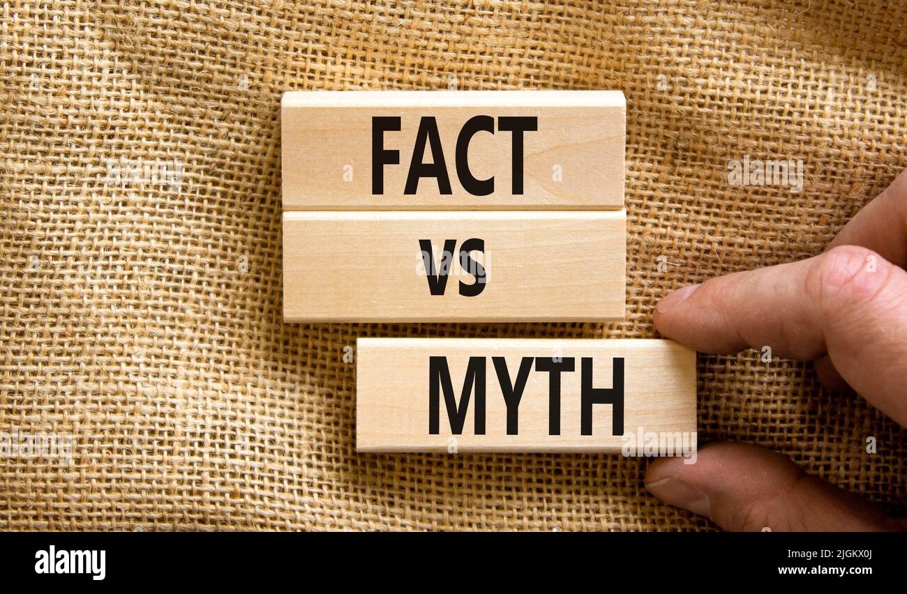 Fact vs myth symbol. Concept words Fact vs myth on wooden blocks on a ...