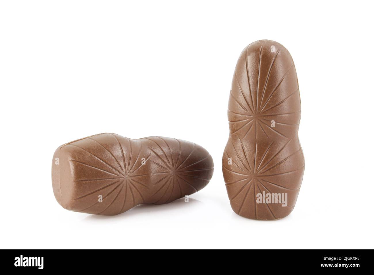 Two chocolate figures isolated on white background. Statue shaped ...