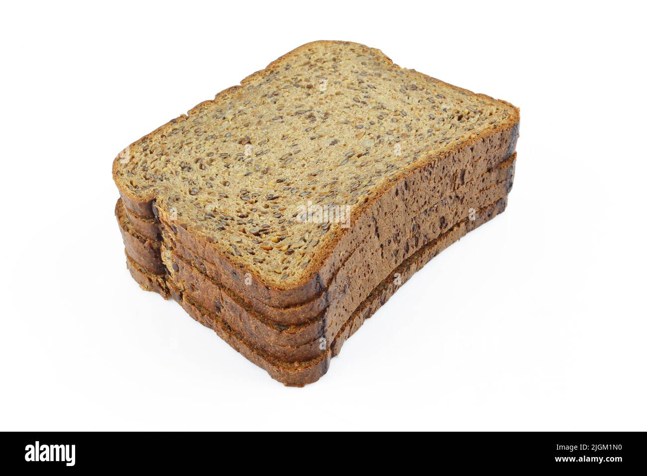 Stacked slices of dark wholemeal rye bread with seeds isolated on white ...