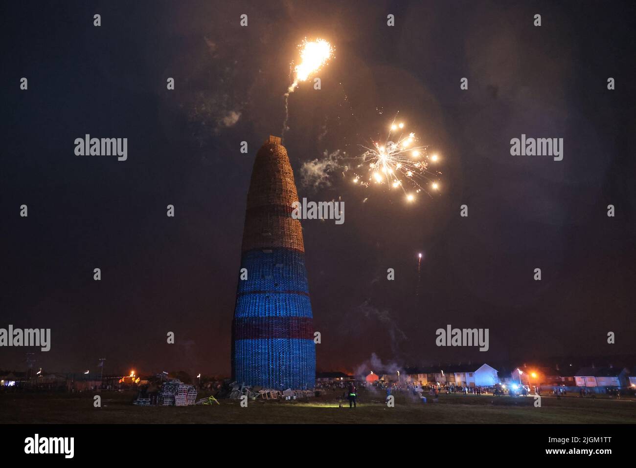 Fireworks explode over the Craigyhill bonfire in Larne, prior to it ...