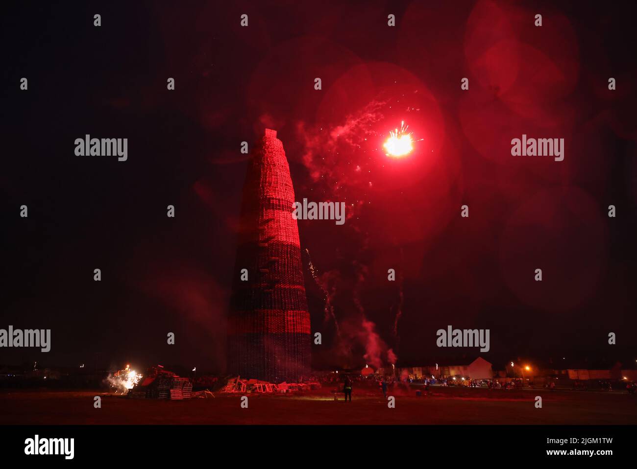 Fireworks explode over the Craigyhill bonfire in Larne, prior to it ...