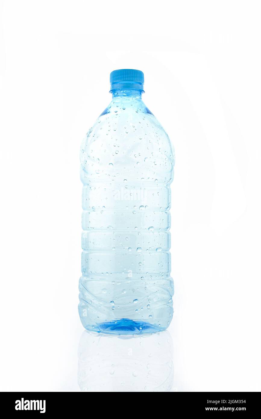 Empty wet transparent bottle isolated on white background. Blue plastic ...