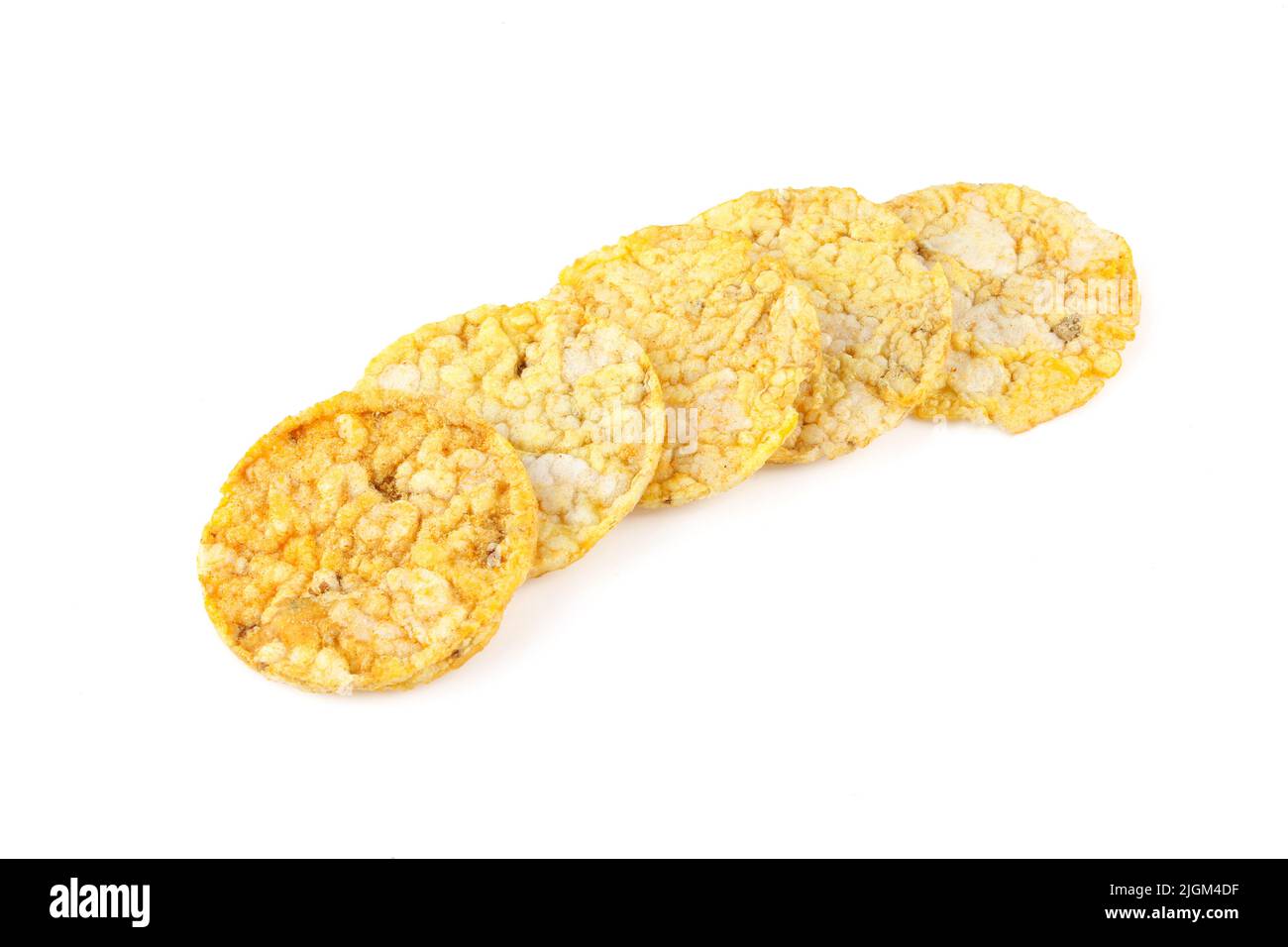 Stack of thin corn rice cracker chips isolated on white background ...