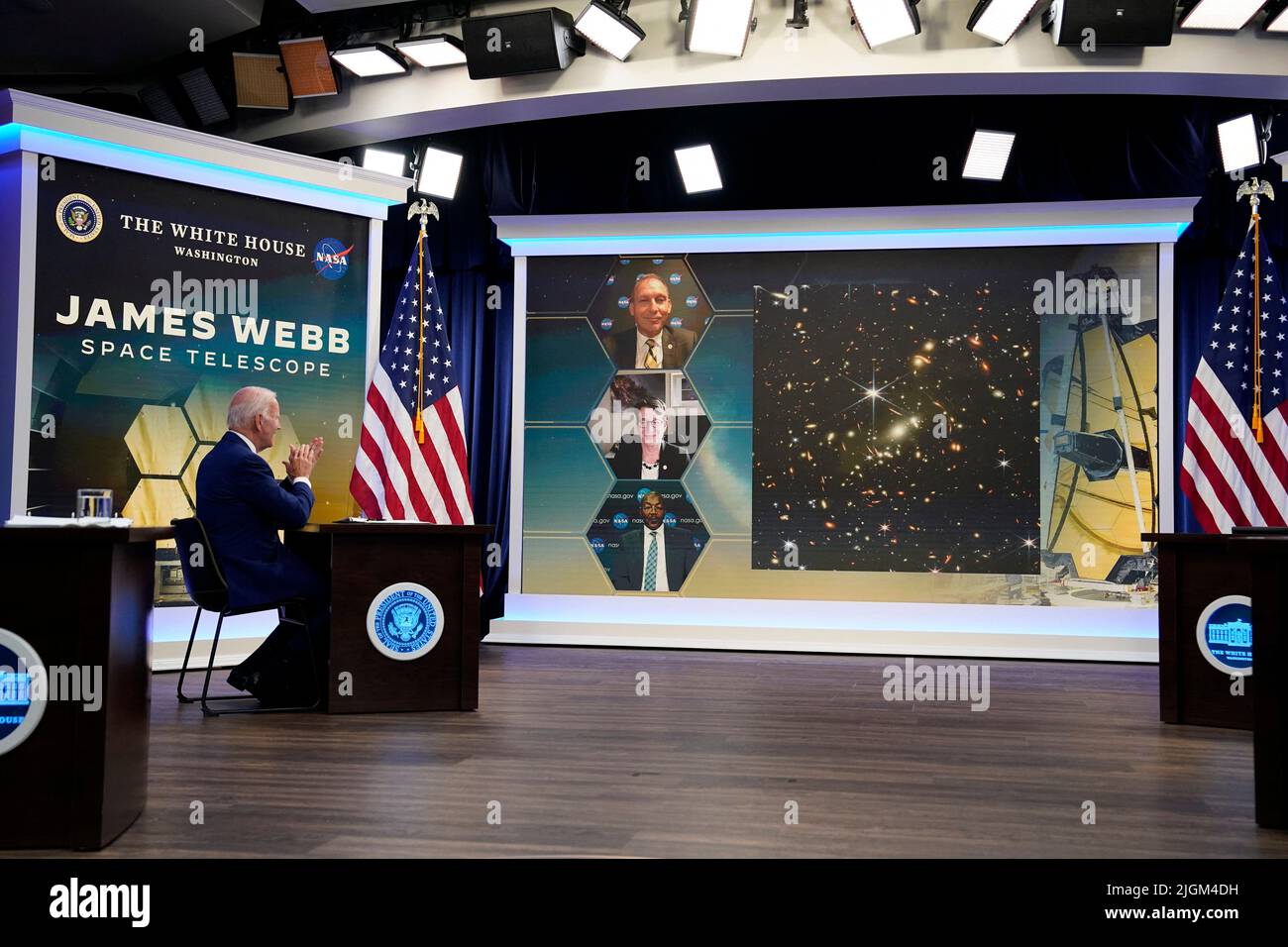 U.S. President Joe Biden applauds as he receives a briefing from NASA ...