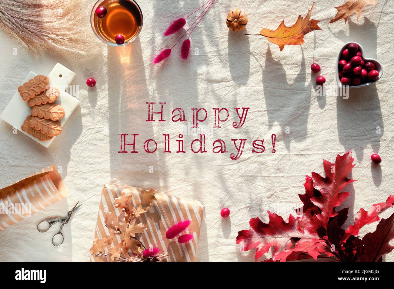 Text Happy Holiday with chrysanthemum flowers, dry bunny tail grass and ...