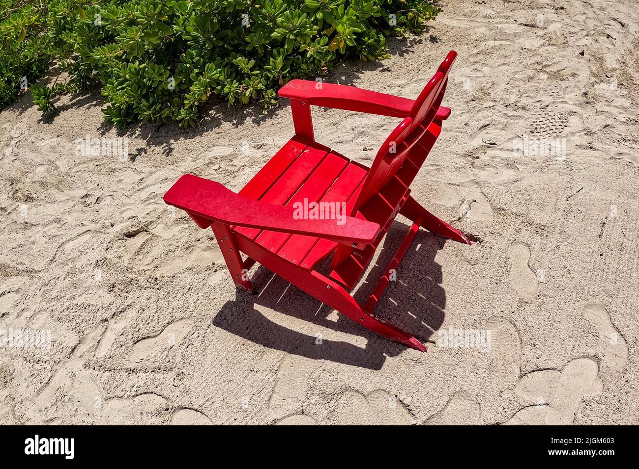 Bright red chair on the beach Stock Photo - Alamy