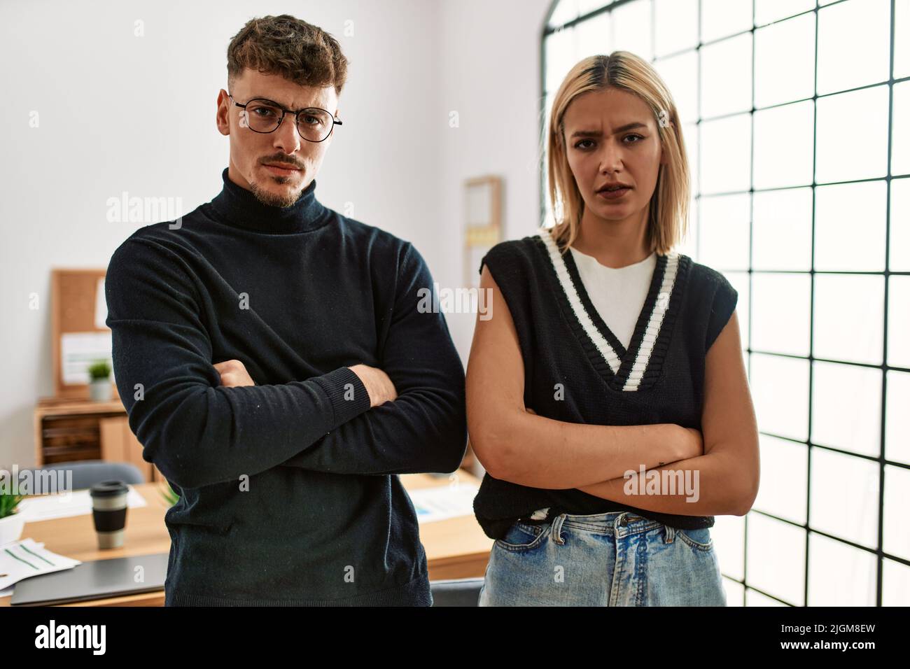 Two beautiful business workers wearing business style standing at the ...