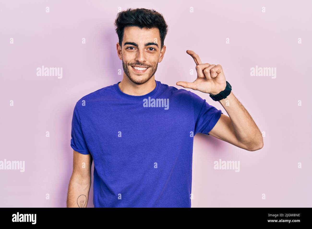 Young hispanic man wearing casual t shirt smiling and confident ...