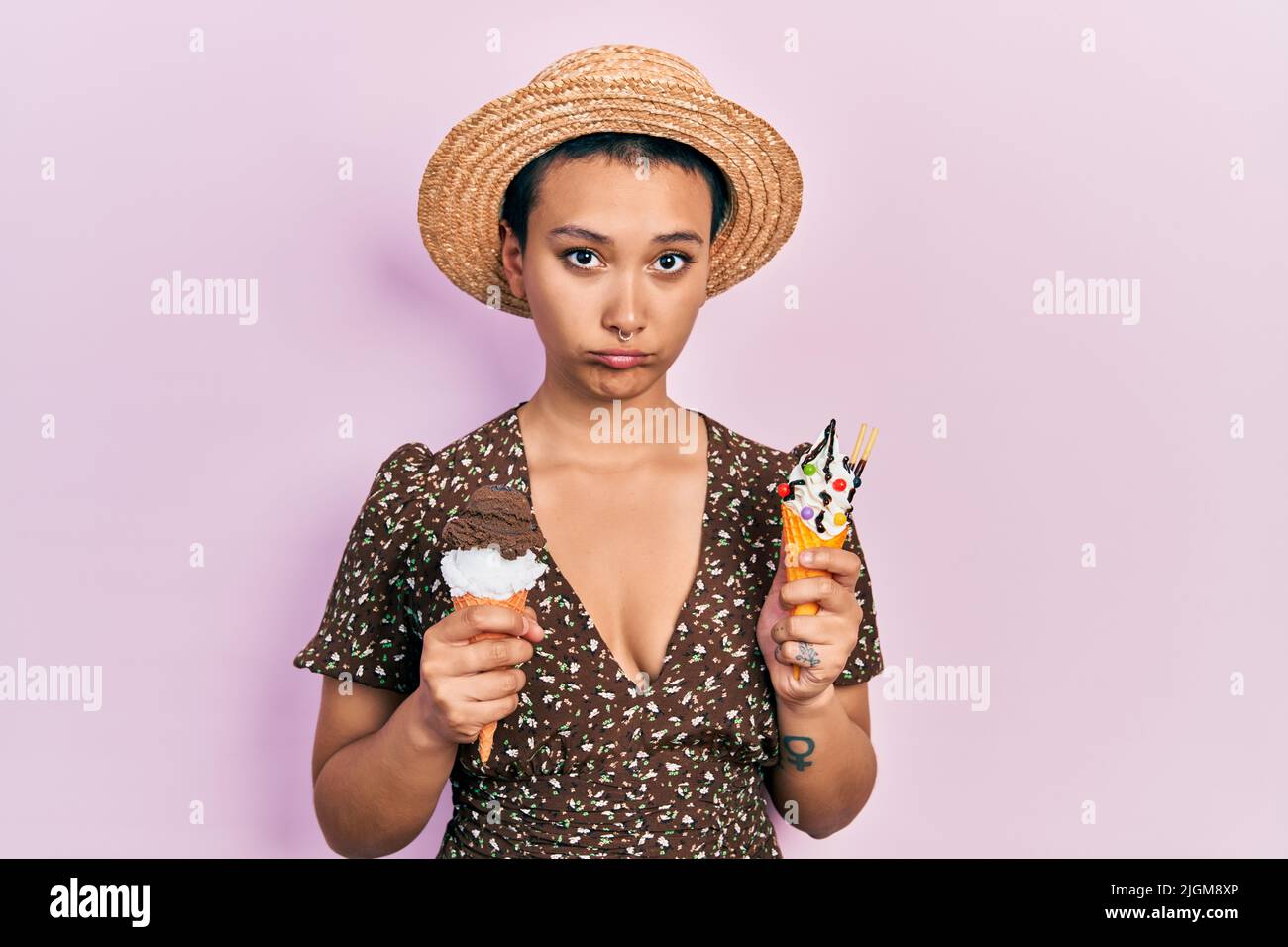 Beautiful hispanic woman with short hair eating ice cream cones ...