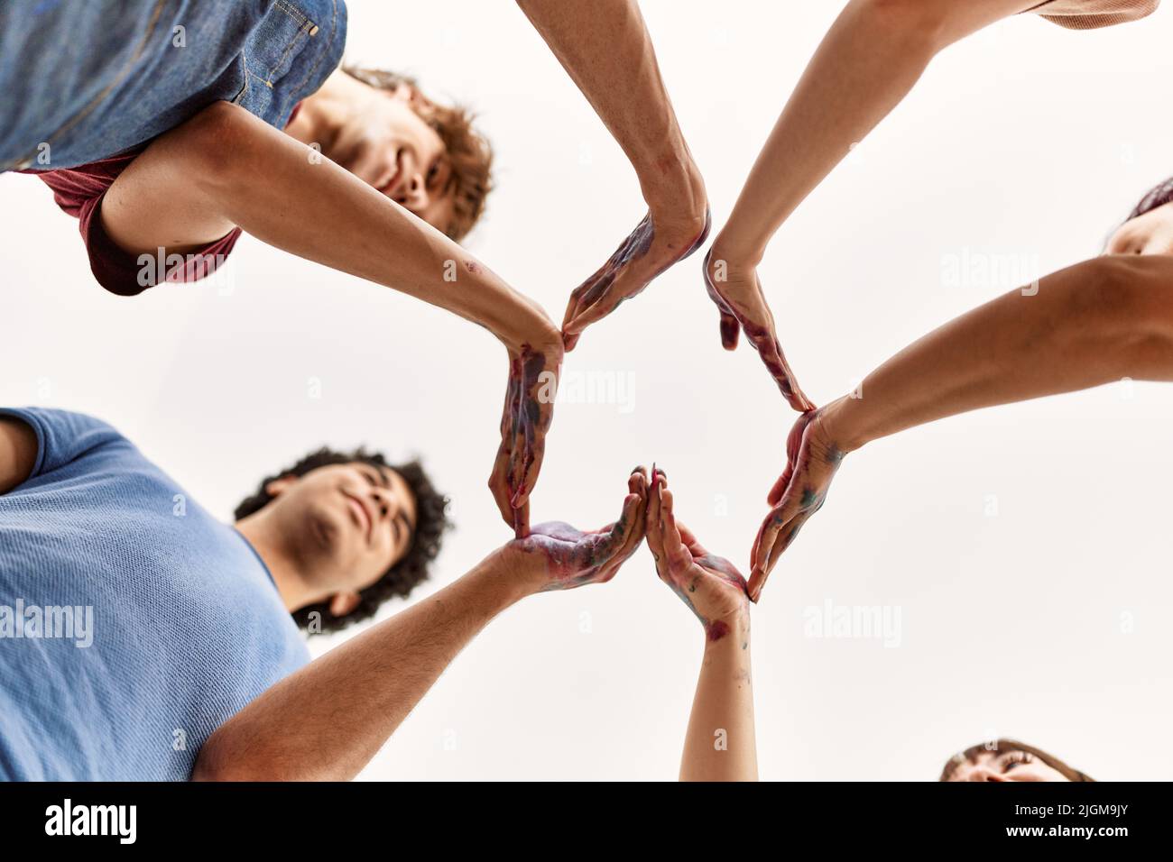 Group of young friends with hands together doing heart symbol Stock ...