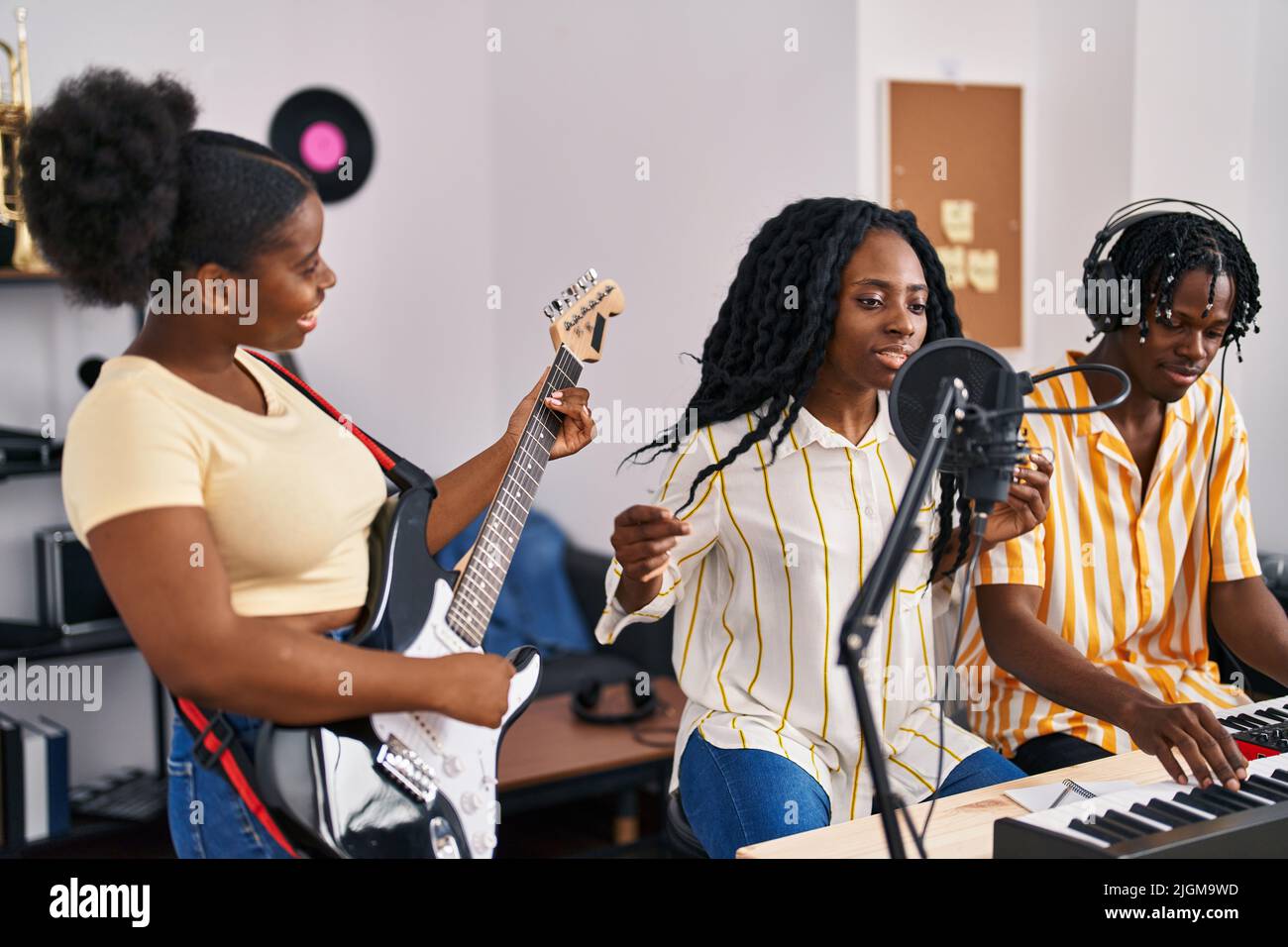 African american friends musicians group singing song at music studio ...