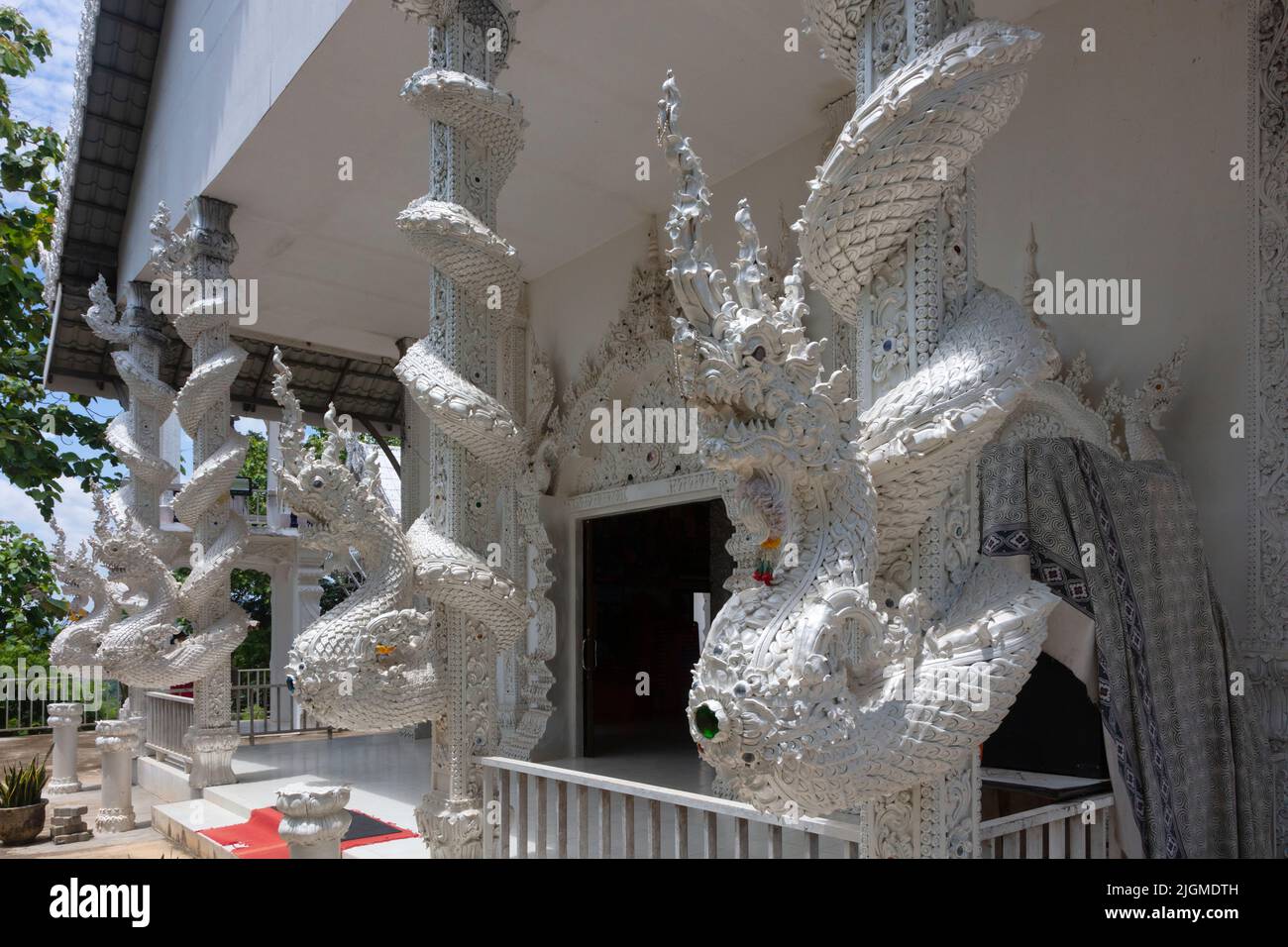 White dragons decorate a Buddhist temple at the GOLDEN TRIANGLE is ...