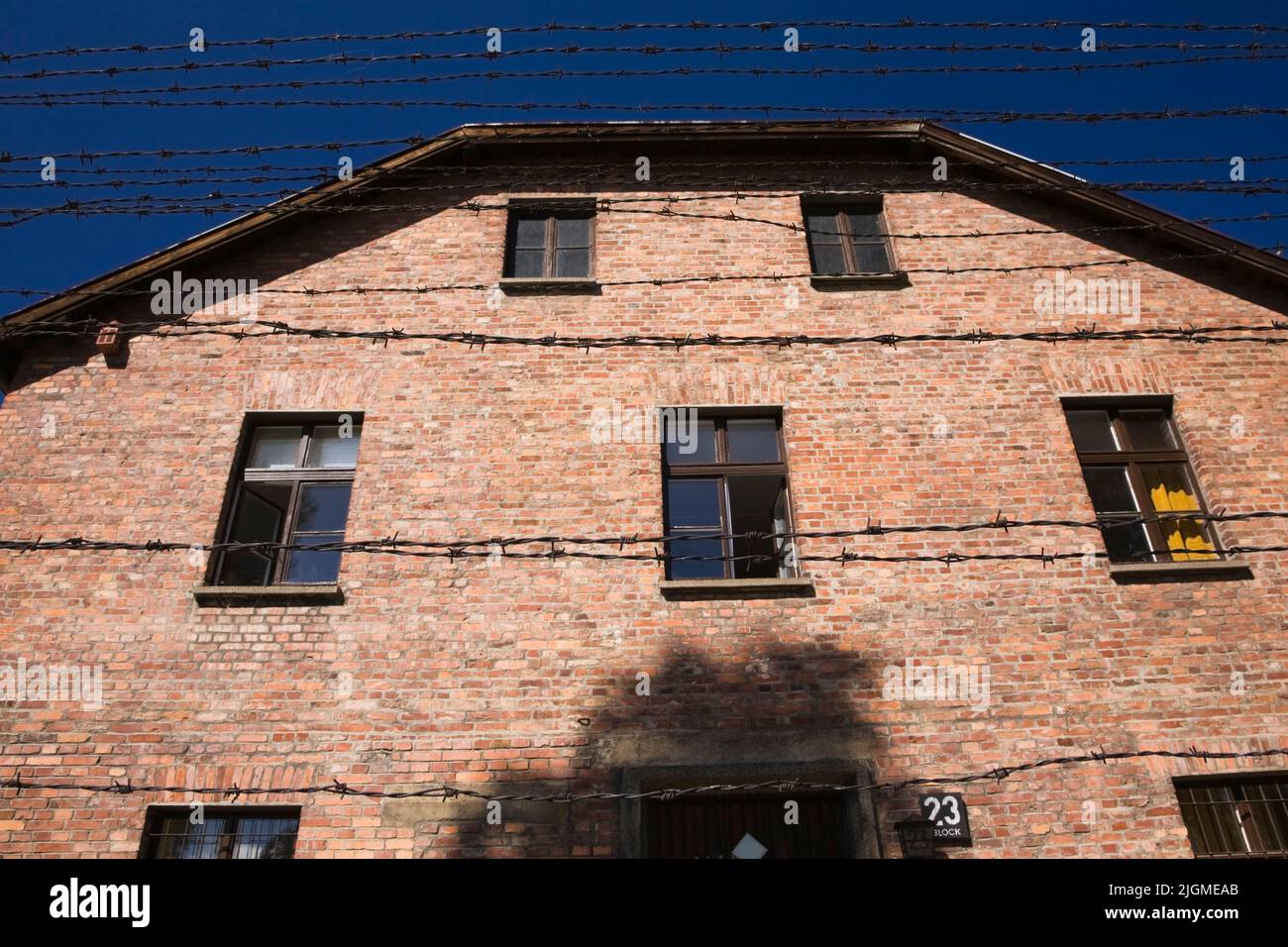 Barb wire fence and building inside the Auschwitz I former Nazi ...