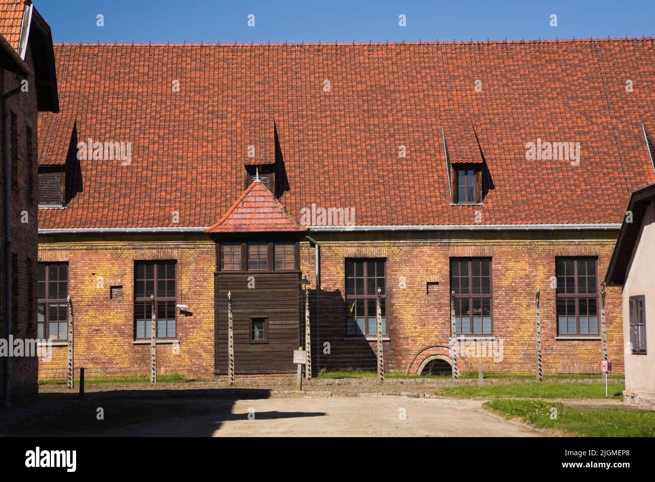 Barb wire fence and buildings inside the Auschwitz I former Nazi ...