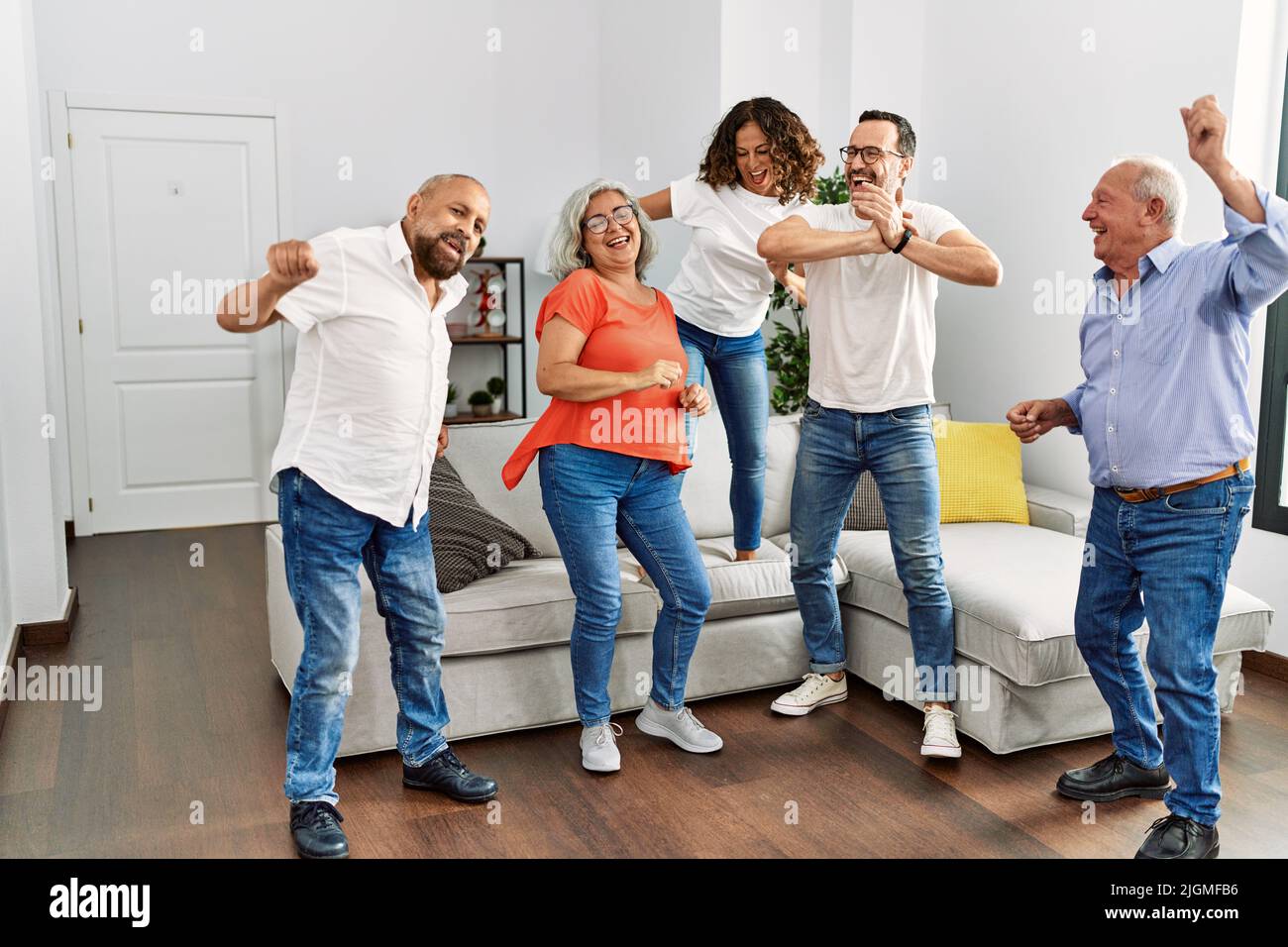 Group of middle age friends having party dancing at home Stock Photo ...