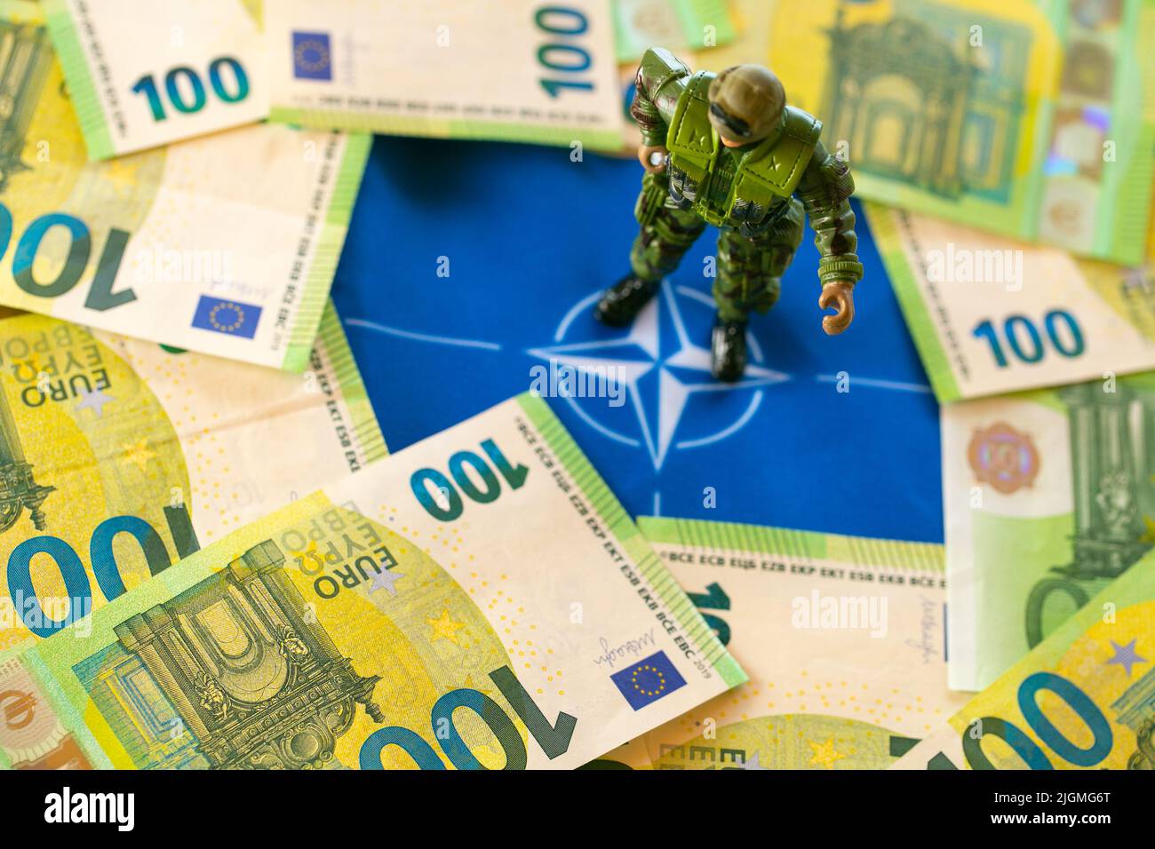 Money for armaments and troops. firearms decorative and euro bills on ...