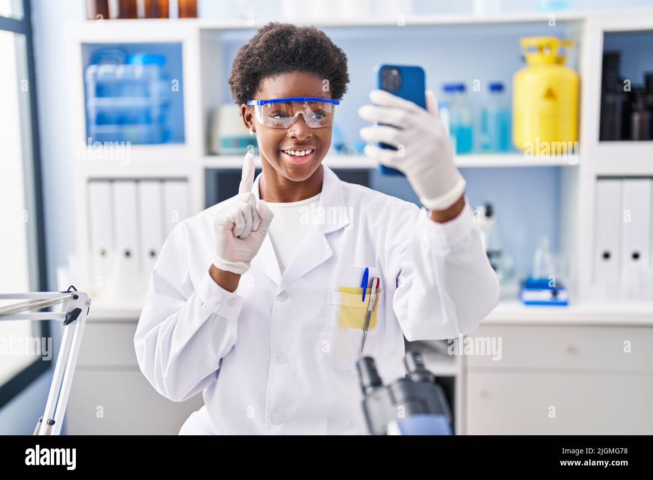 Scientist woman looking phone female hi-res stock photography and ...