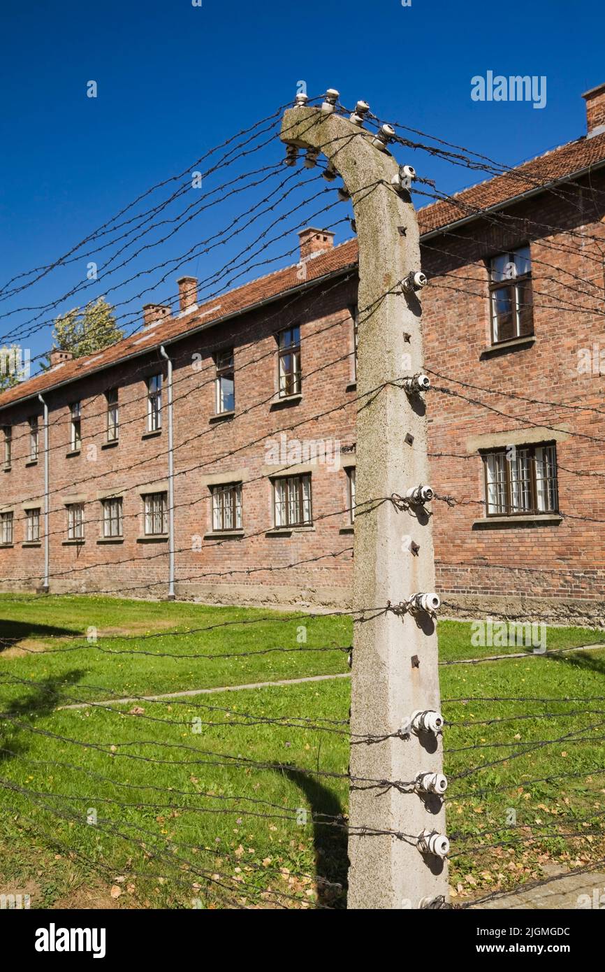 Barb wire electric fence and building inside the Auschwitz I former ...