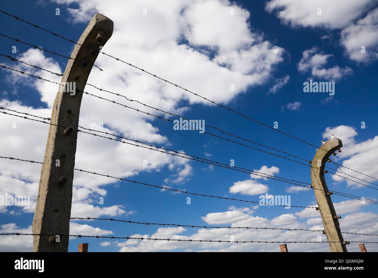 Barbed wire electric fence inside the Auschwitz II-Birkenau former Nazi ... Barbed wire electric fence inside the Auschwitz II-Birkenau former Nazi ...