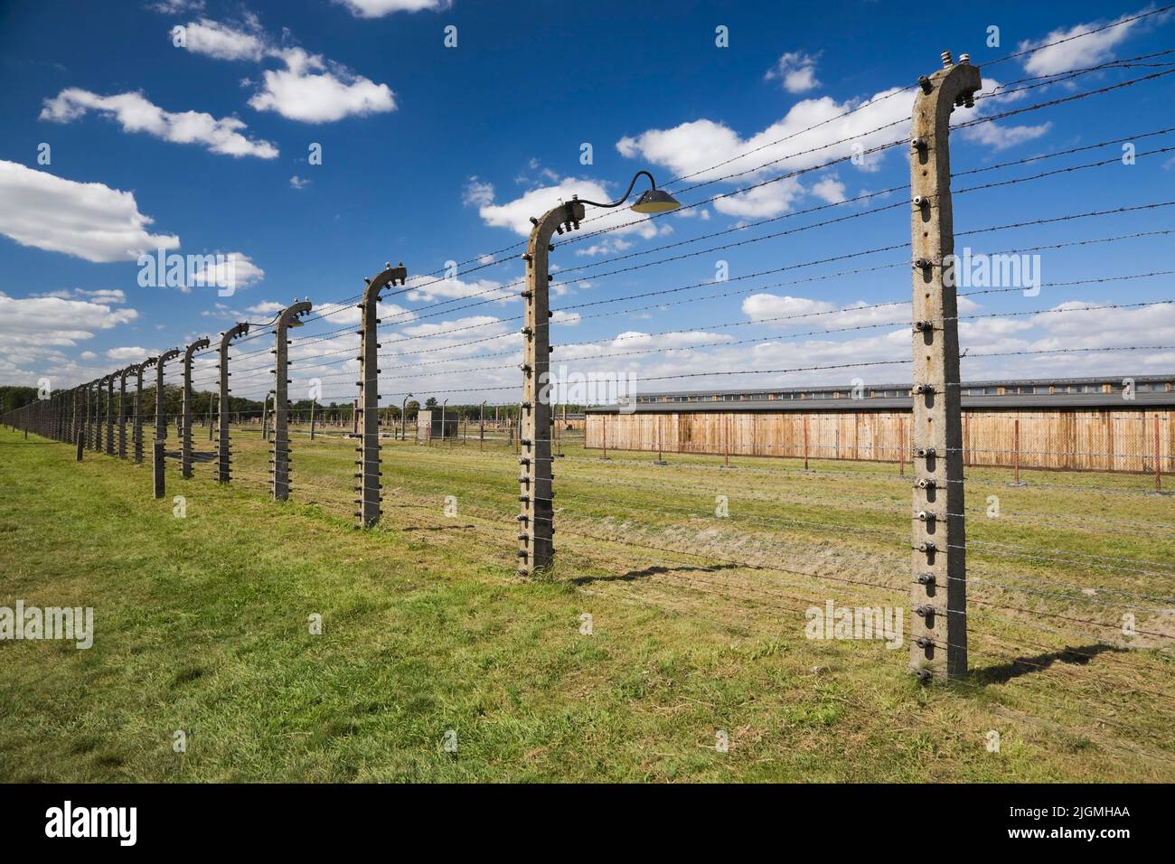Barbed wire electric fence surrounding the Auschwitz II-Birkenau former ... Barbed wire electric fence surrounding the Auschwitz II-Birkenau former ...