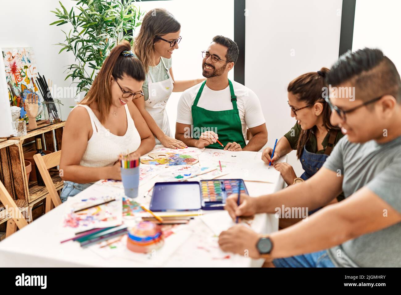 Group of draw students sitting on the table drawing at art studio Stock ...