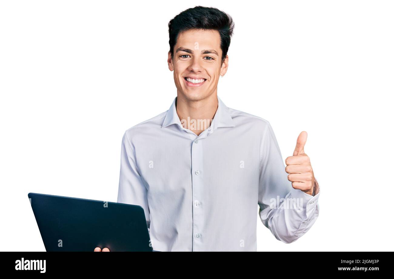 Young hispanic business man working using computer laptop smiling happy ...