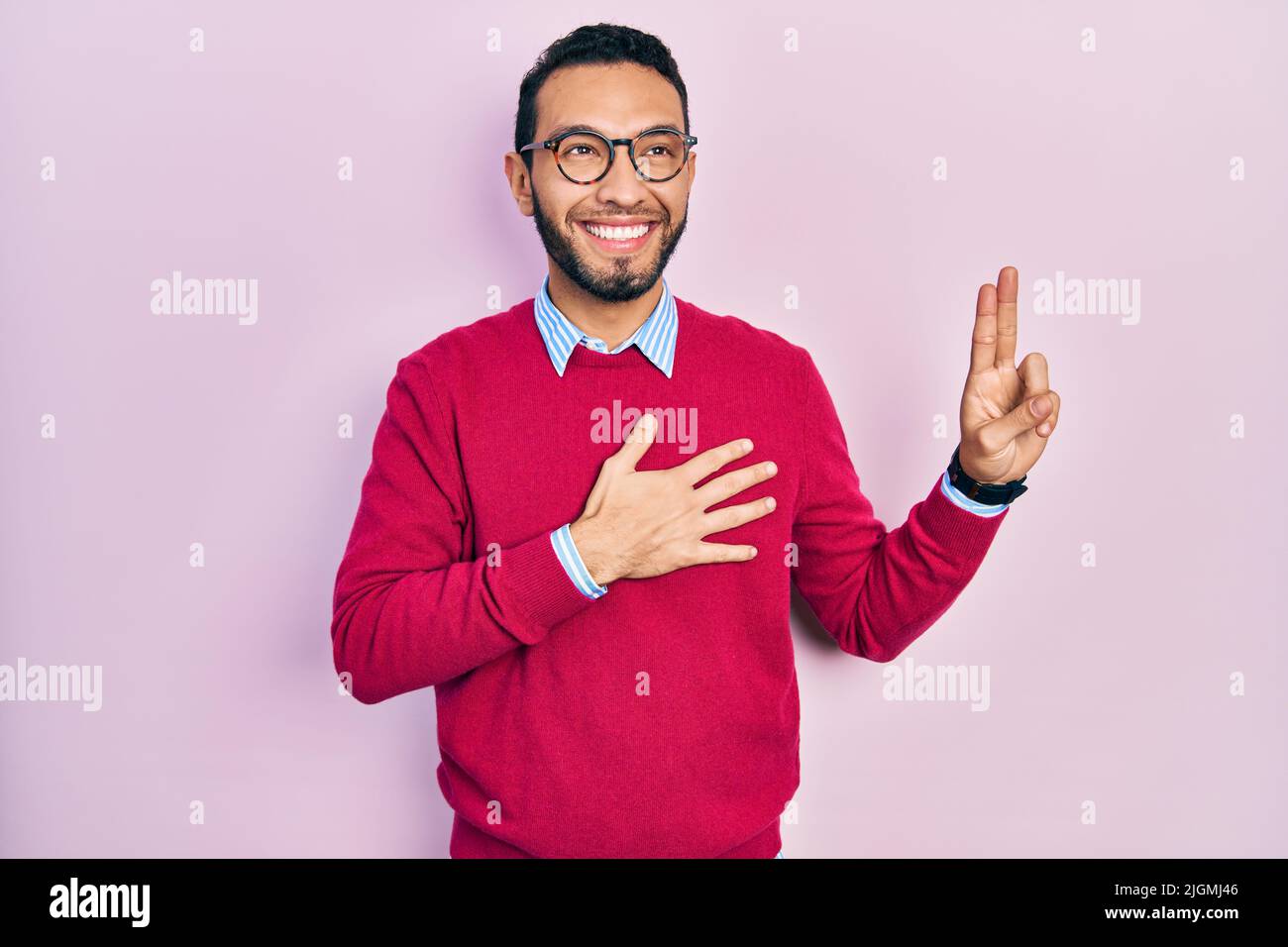 Hispanic man with beard wearing business shirt and glasses smiling ...