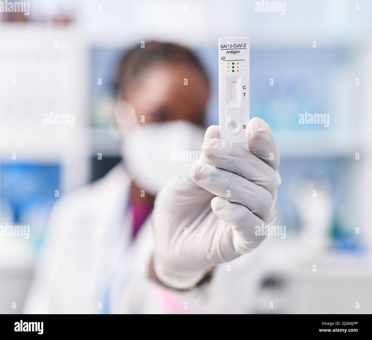 African american woman wearing scientist uniform and medical mask ...