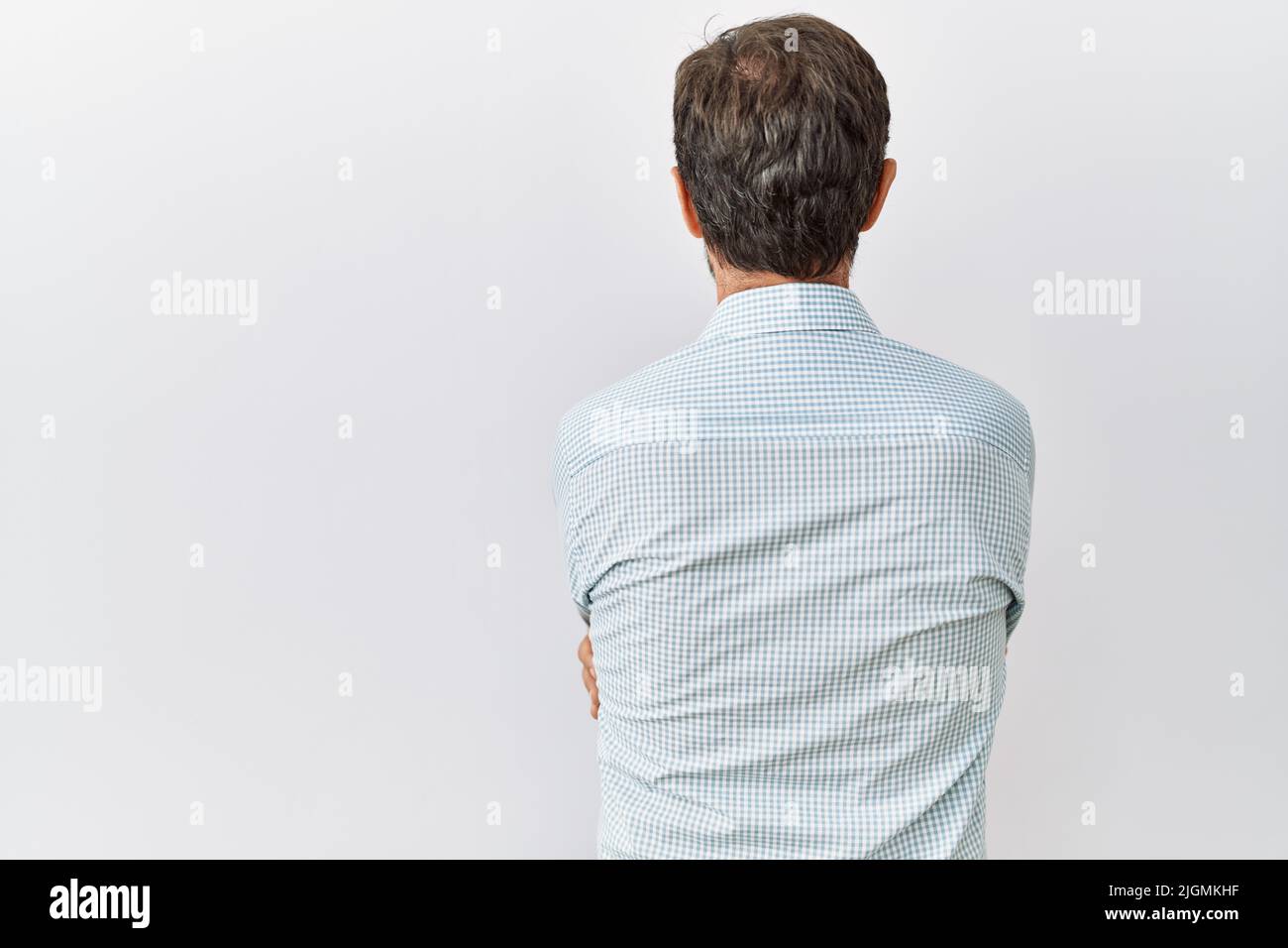 Middle age hispanic man with beard standing over isolated background ...