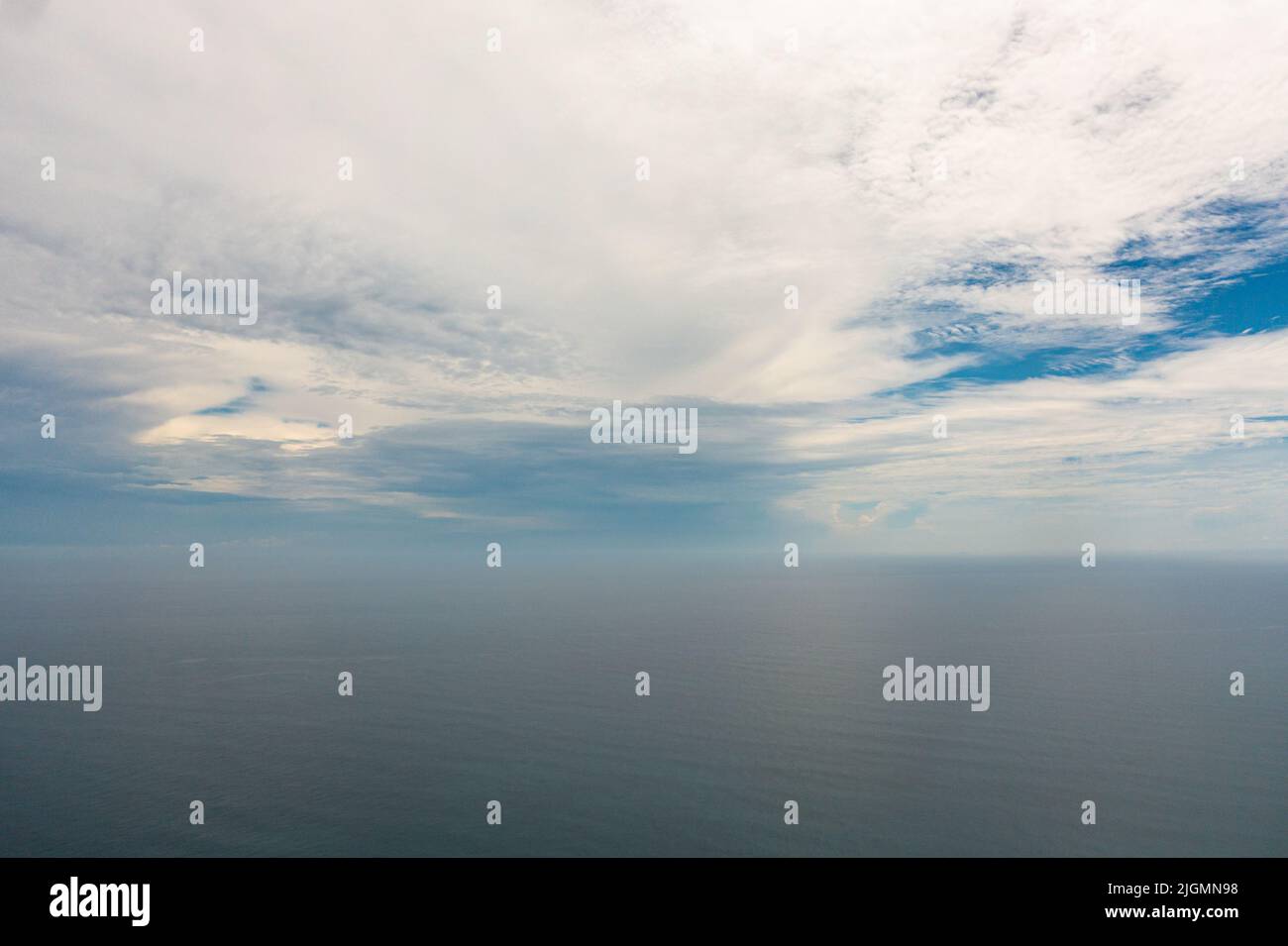 Aerial view of Blue sea with waves and sky with clouds. Ocean skyline ...