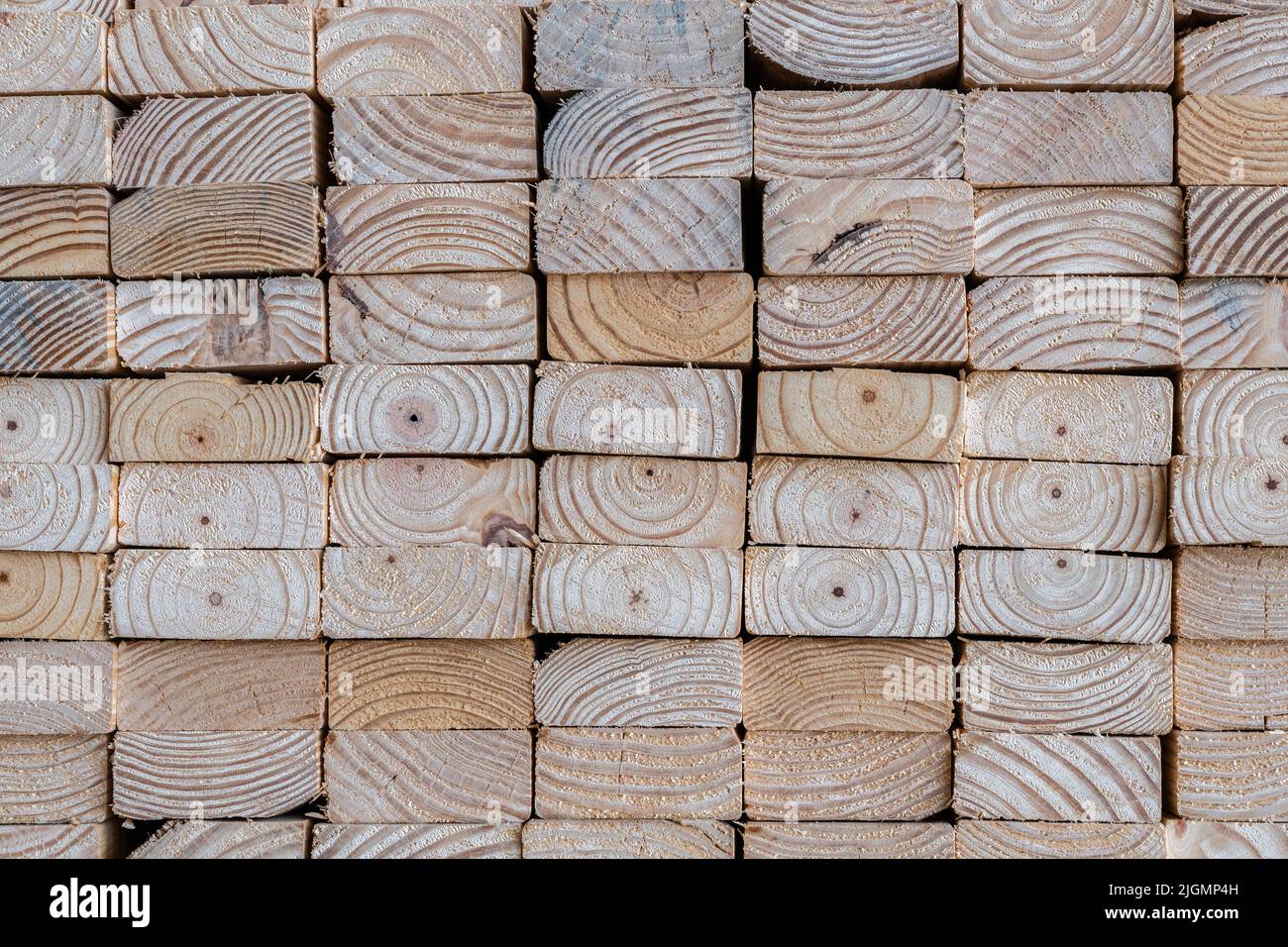 Photograph of the end profile of a stack of 2 x 4's in a lumber yard ...