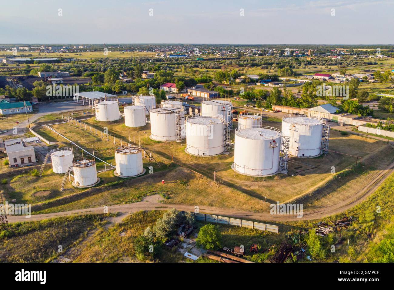 Tanks with petroleum products are among the fields near the village ...