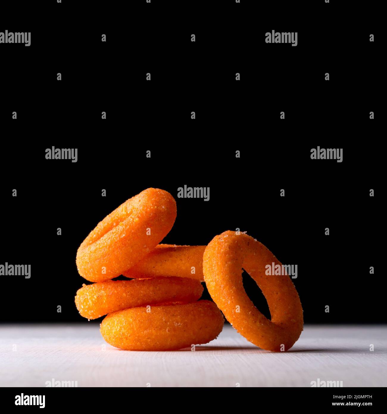 closeup side view of crispy doughnut or donut, crunchy deep fried snack ...